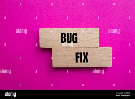 Bug Fix Words Written On Wooden Blocks With Pink Background Conceptual