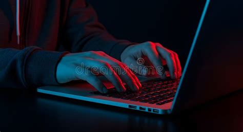 Cybersecurity Hacker Typing Fast On Laptop In The Dark Cybercrime Threat Protection Stock