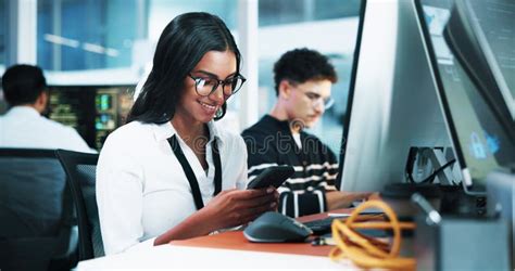 Computer Programmer And Woman With Smartphone In Office Coding