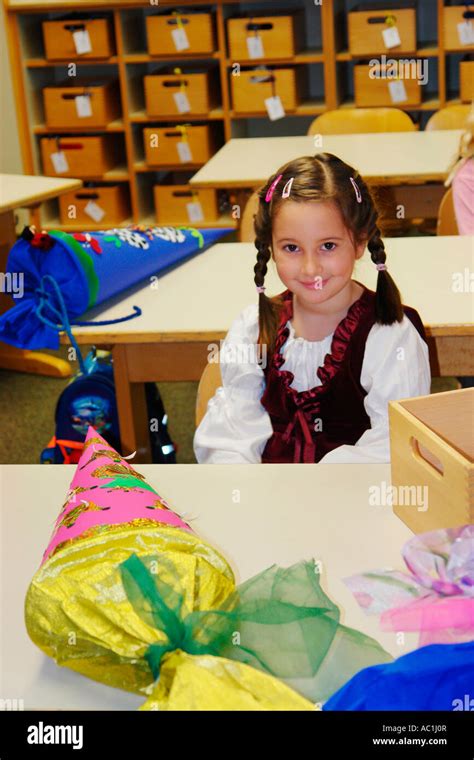 Girl With Babe Cone Sitting In Classroom Stock Photo Alamy