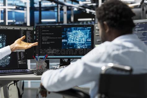 Server Room Worker Using Ai To Perform Demanding Computing Tasks Stock