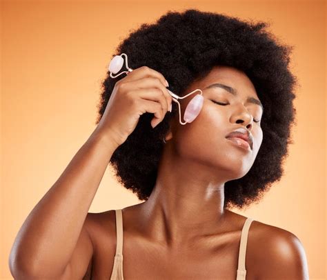 Premium Photo Beauty Afro And Black Woman With Skincare Derma Roller