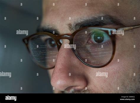 Line Of Code Reflected In Glasses Of Software Programmer And Web