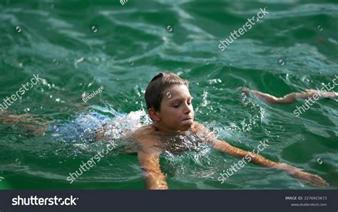 Boys Swimming In River Premium Photo Boys Swimming In River