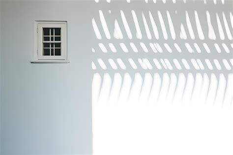 premium ai image a shadow created by a window overlaying on a white