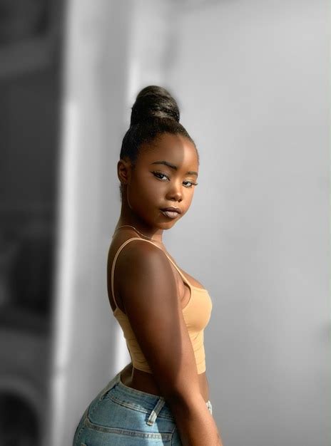 Premium Photo Portrait Of Woman Standing Against Wall