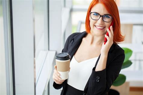 Premium Photo Young Redhead Businesswoman With A Lovely Smile