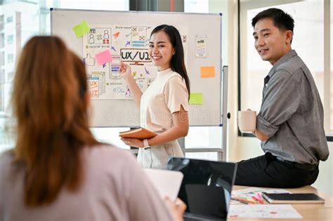 A Professional Tech Developer Team Is In The Meeting Brainstorming On A New Mobile App Together