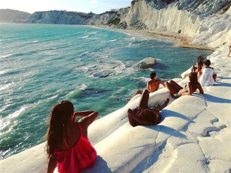 Premium Photo Man And Women Relaxing On Rocks At Scala Dei Turchi