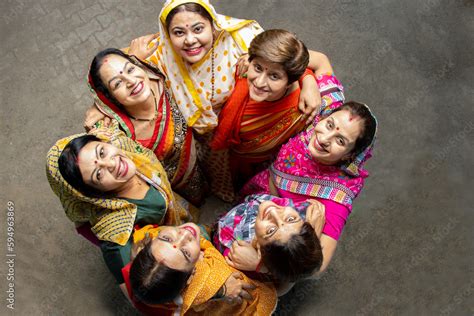 Group Of Happy Young Traditional Indian Women Wearing Colorful Sari