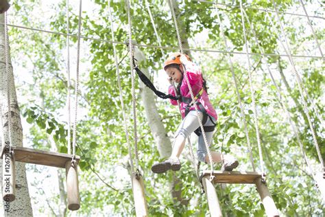 Babe Girl Playing In Tree Top Adventure Park Stock Photo Adobe Stock