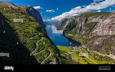 A Scenic View Of A Winding Road Snaking Its Way Through The Dramatic