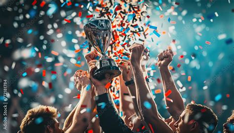 A Team Celebrating With The Championship Trophy After Winning The Big
