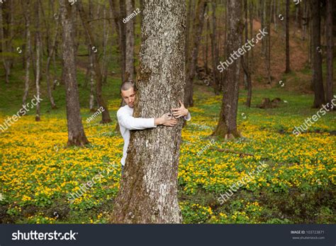 A Happy Man Hugging A Tree In Forest Stock Photo Shutterstock