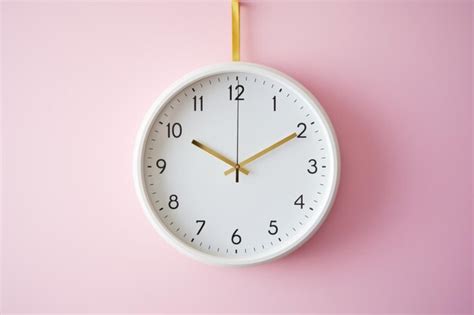 Premium Photo Person Adjusting A Plain Analog Wall Clock Minimal Decor