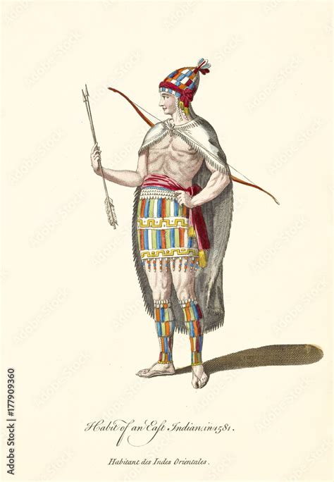 East Indian In Traditional Dresses Holding Two Arrows Bow On His Back