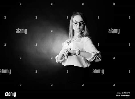 Studio Portrait Of Blonde Businesswoman In Glasses White Blouse And