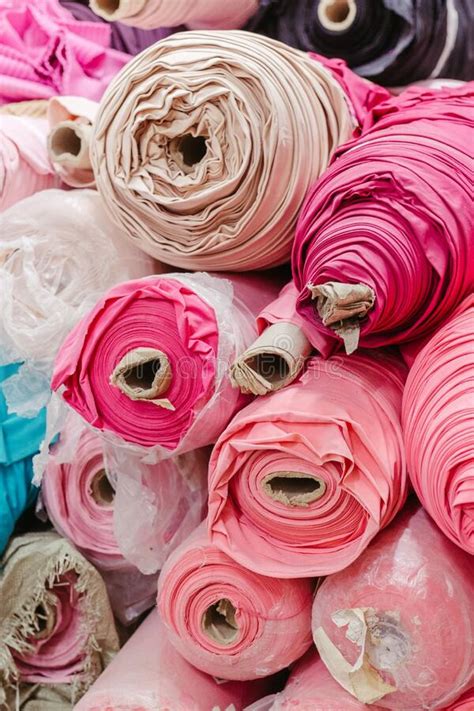 Vibrant Collection Of Multicolored Fabric Rolls And Swatches Arranged