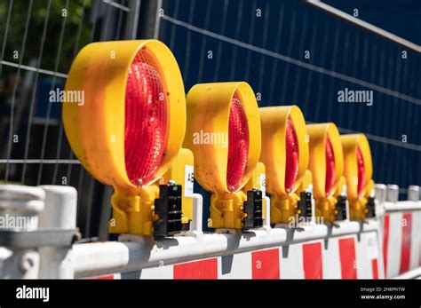 Five Red Colored Hazard Lights On A Construction Site Barrier Stock