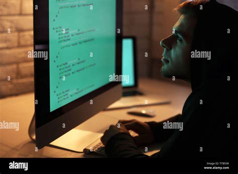 Hacker With Computer And Laptop Stock Photo Alamy