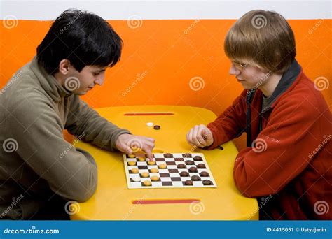 Two Boys Play Checkers Stock Image Image Of Group Orange 4415051