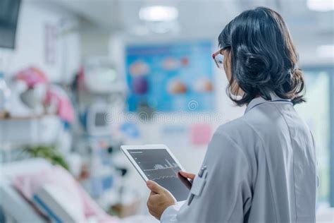 Healthcare Practitioner Using Tablet To Explain Patient Data In Hospital Stock Image Image Of