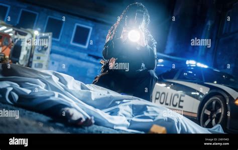 Black Female Police Officer Investigating A Murder Case At A Crime Scene Policewoman Taking
