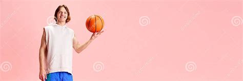 Sportsman Young Basketball Player Dressed Retro Uniform And Spins