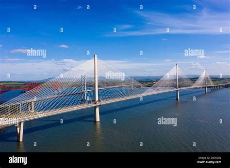 Aerial View Of Three Bridges Crossing The River Forth With New Queensferry Crossing In Front At