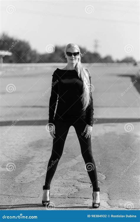 Attractive Young Woman With Long Beautiful Blonde Hair Posing Outdoors