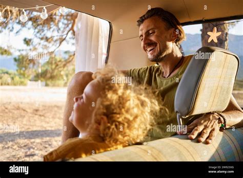 Father Laughing With Babe And Spending Leisure Time In Caravan Stock Photo Alamy
