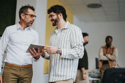 Confident Colleagues Collaborating In A Corporate Office Analyzing