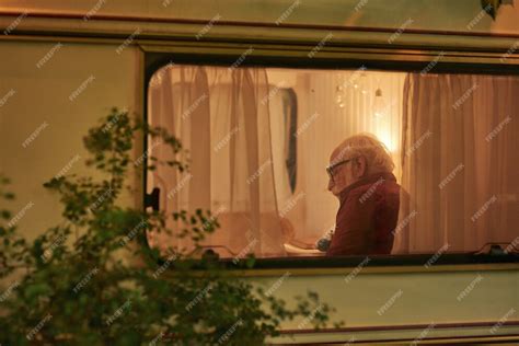 Premium Photo Senior Male With Map Sitting In His Camper Van In The