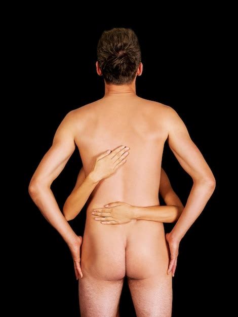 Premium Photo Rear View Of Shirtless Man Against Black Background