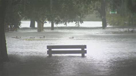 2 orlando lakes flood into each other due to heavy rain from hurricane