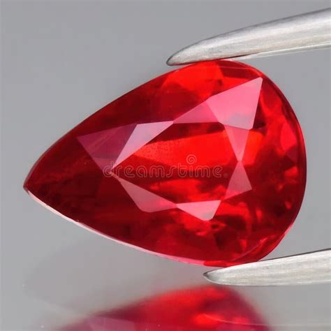 Lustrous Ruby Gemstone Captured In Brilliant Clarity Against A Sleek Metallic Backdrop Stock