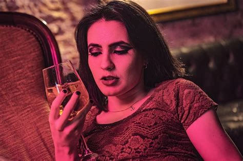 Premium Photo Seductive Rebel Brunette Girl Holding A Drink With A