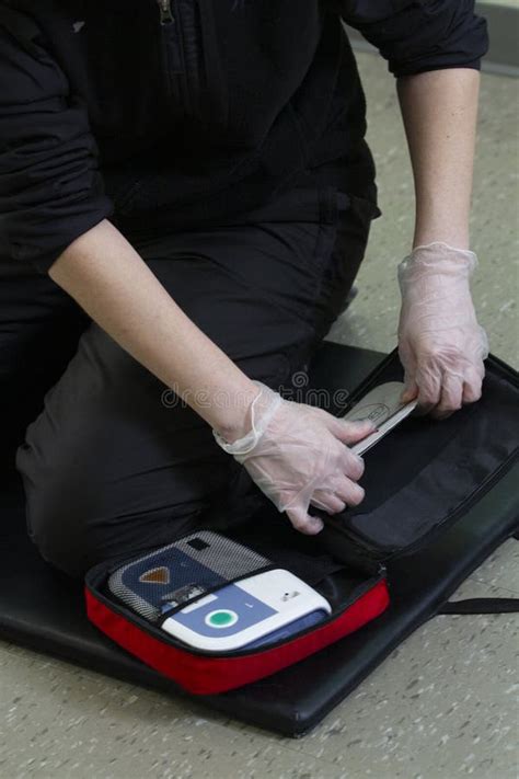 First Response Worker Demonstrates Cpr And Proper Defibrillator