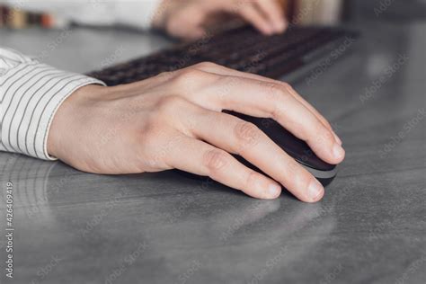 Business Woman Clicking Mouse And Typing On Keyboard At Work Stock Photo Adobe Stock