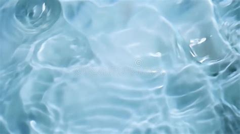Light Reflections On Rippling Water Surface With Soft Blue Tones Abstract Nature Background