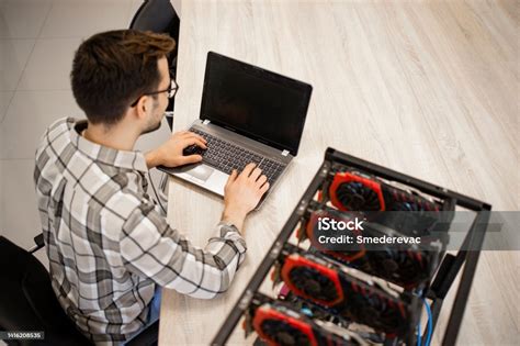 Top View Of Programmer Working On His Cryptocurrency Mining Rig