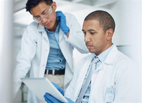 Premium Photo Men Tablet And Collaboration In Science Laboratory For