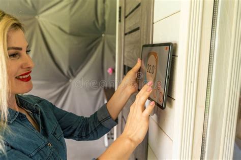 Modern Home Smart Automation App On Tablet Display In Woman Hands