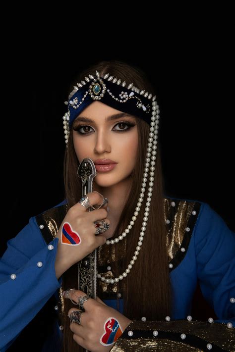 Photo Of A Redhead Woman Standing Against Black Background · Free Stock