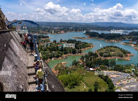 Tourists At The Top Of The Piedra Del Penon Or Penon De Guatape Near