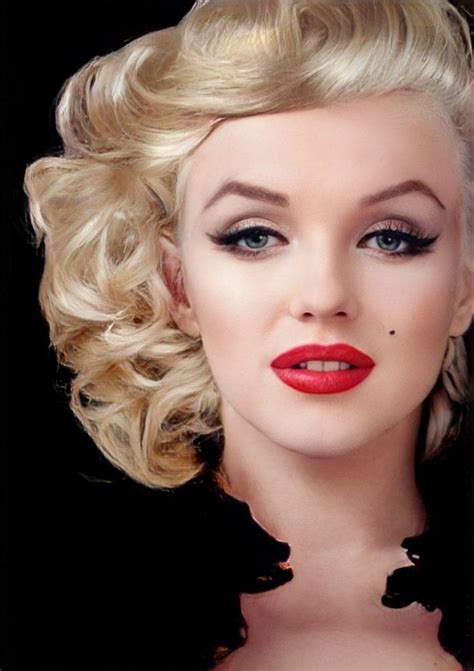 A Woman With Blonde Hair And Red Lipstick