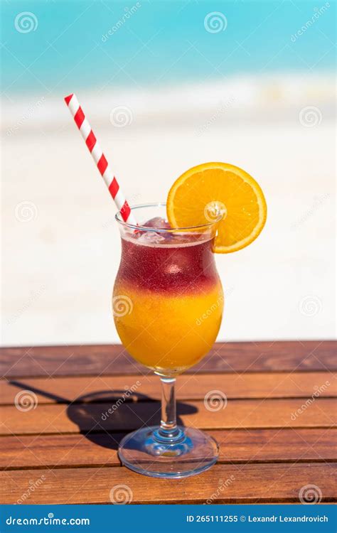 Vertical Photos Of Sex On The Beach Cocktail With Straw On Wooden Table At The Beach Stock Image