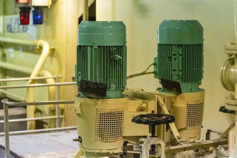 Detailed View Focuses On The Lubricating Oil Pumps In The Ship S Engine