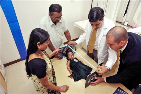 Guinness World Records Jyoti Amge Has Her Height Measured In Her Home