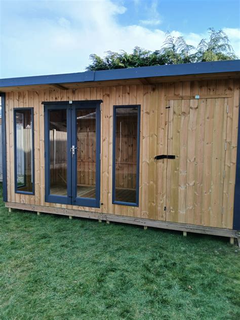 Vertically Cladded Contemporary Royal Shed Combi Pent Roof With Overhang